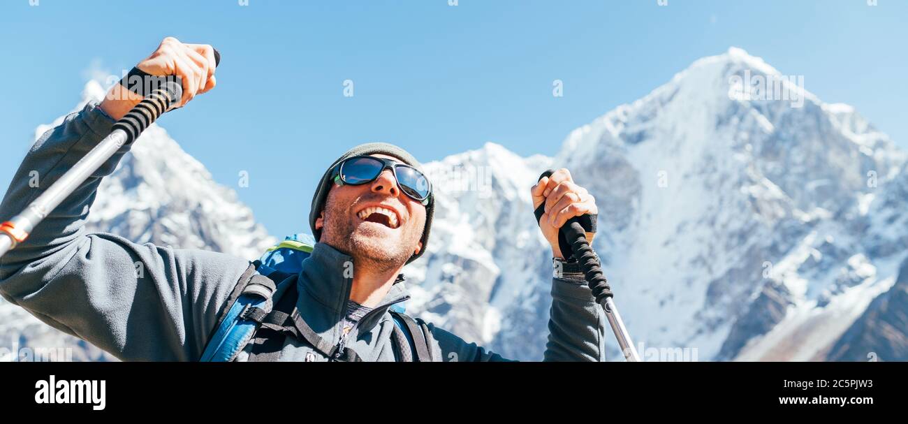 Portrait of smiling Hiker man on Taboche 6495m and Cholatse 6440m peaks ...
