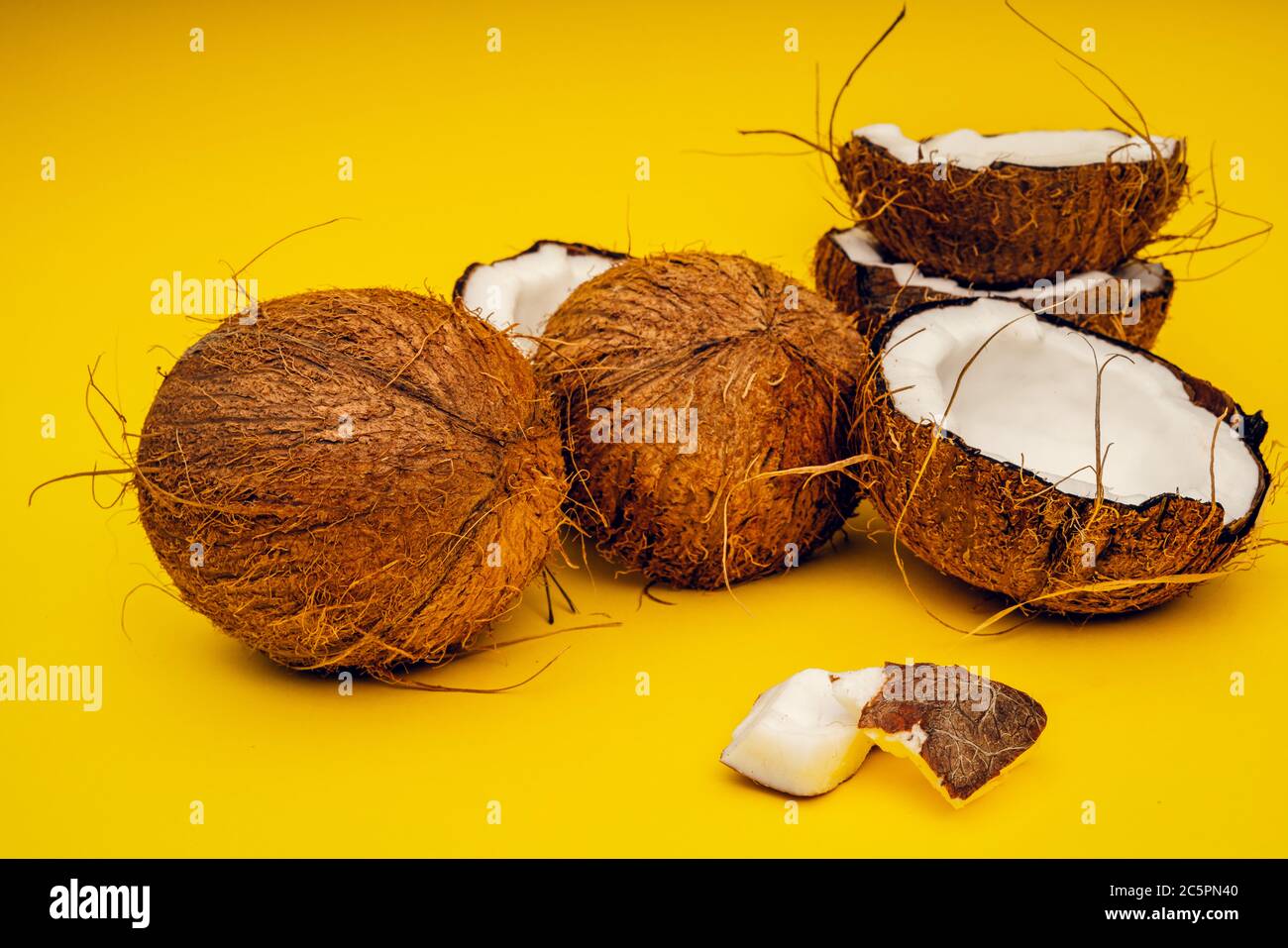 Parts of coconut on a colored background. Close up. Fresh ripe coconut ...