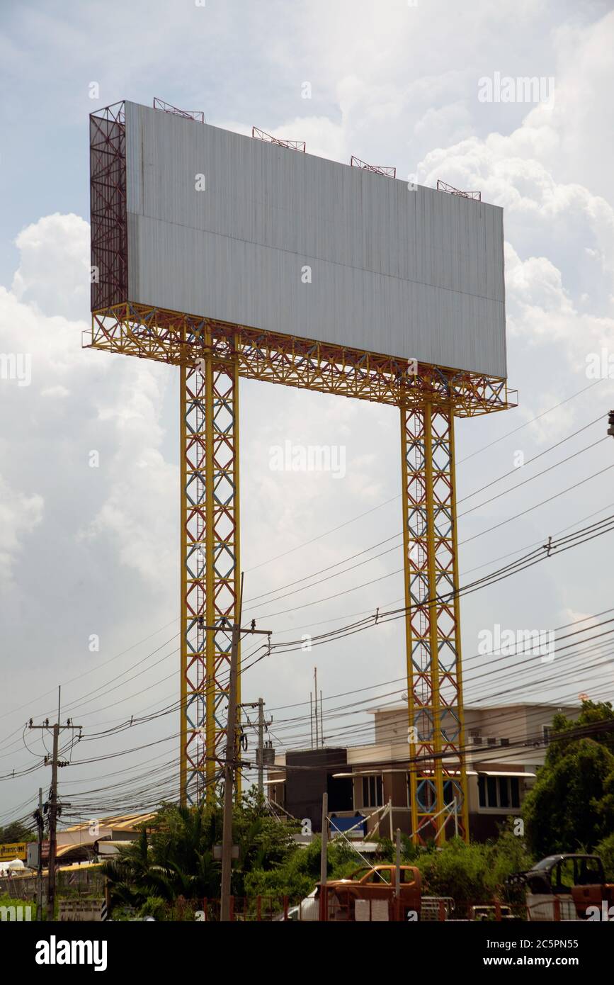 Large gray outdoor advertising signs on the side of the highway or ...