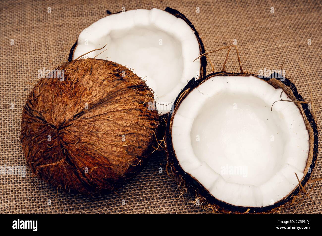 Parts of coconut on a colored background. Close up. Fresh ripe coconut ...