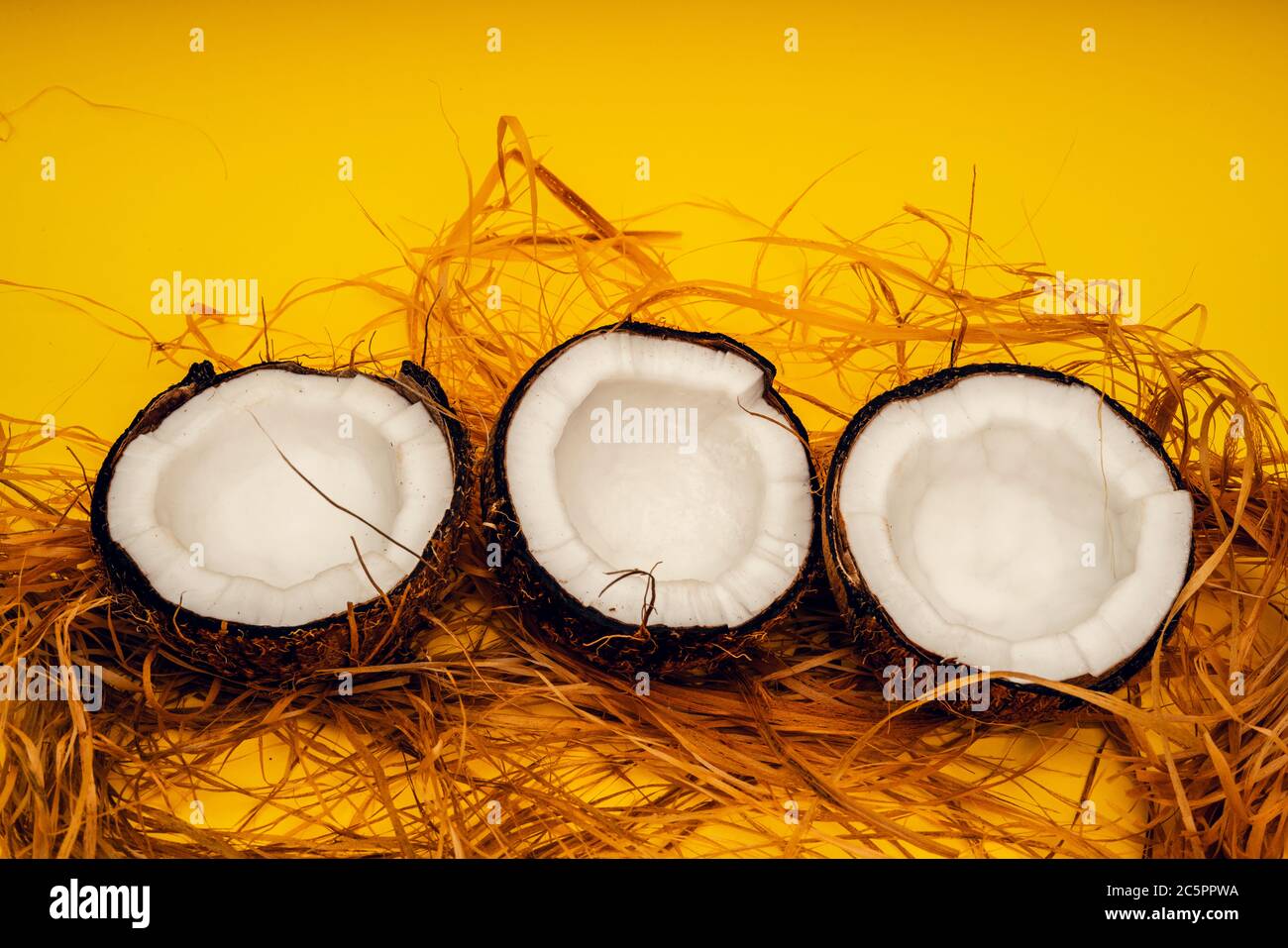 Parts of coconut on a colored background. Close up. Fresh ripe coconut ...