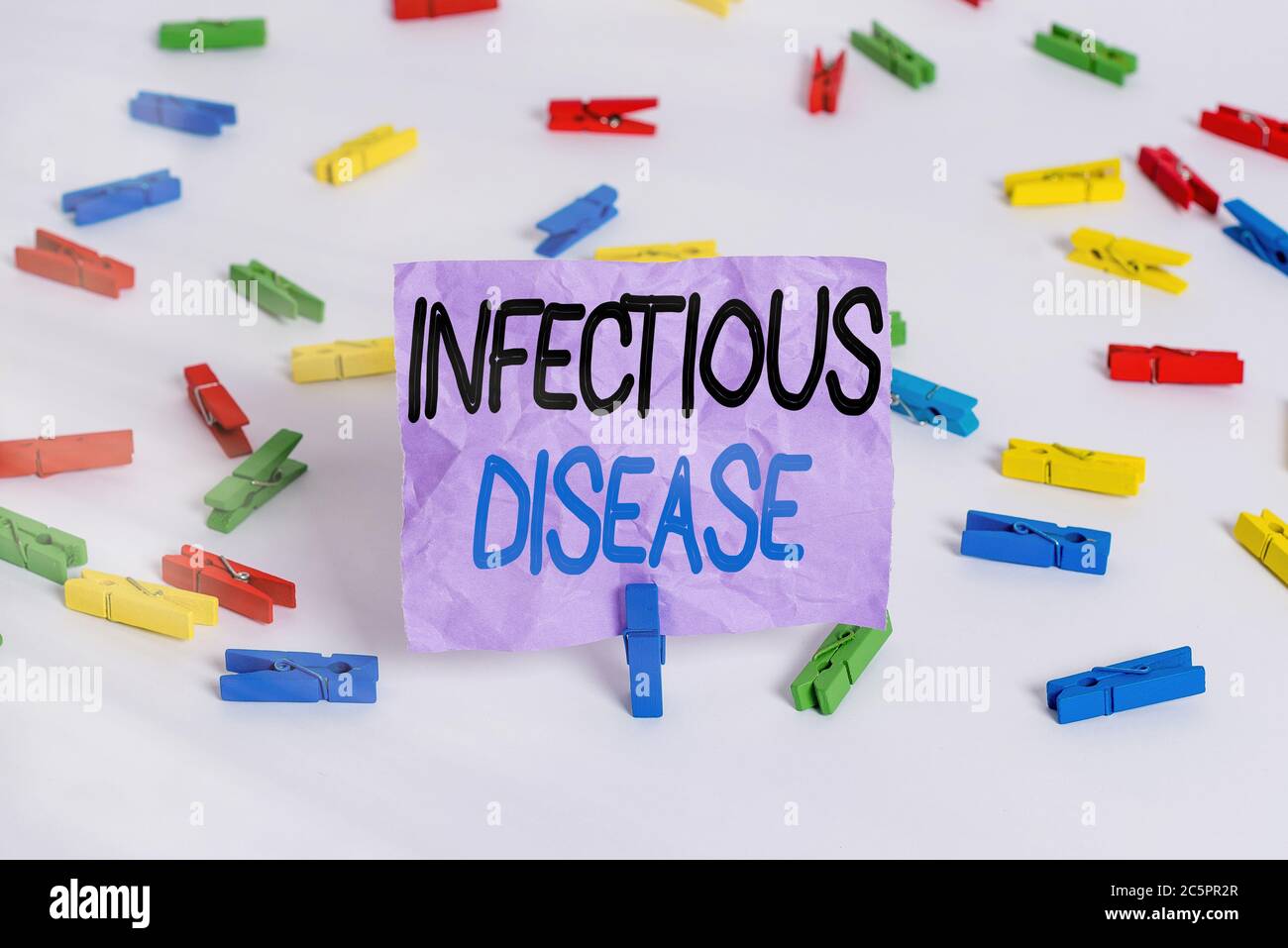 Writing note showing Infectious Disease. Business concept for caused by ...