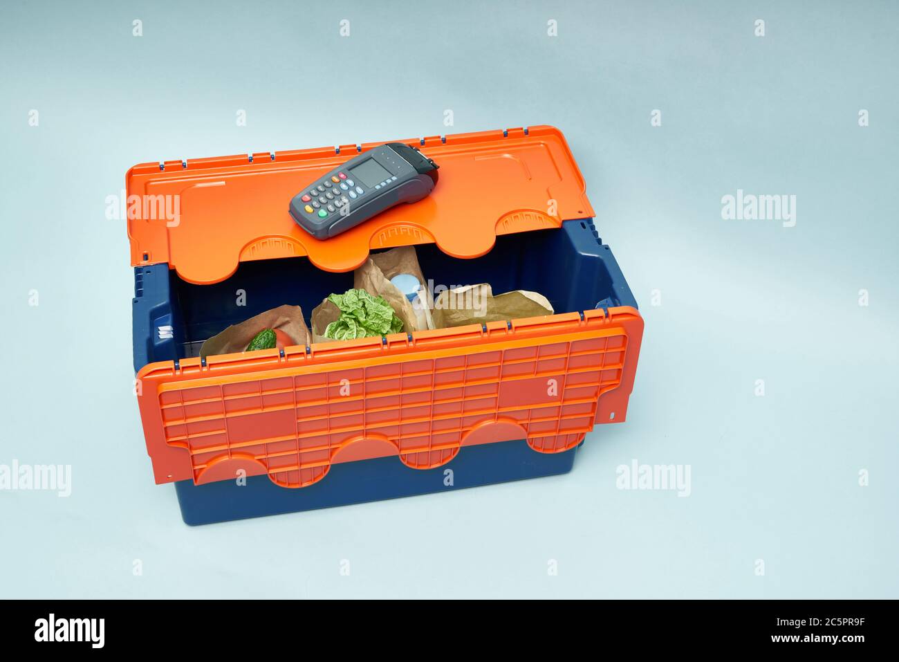 Plastic box with products. Food delivery in platinum boxes. Safe ...