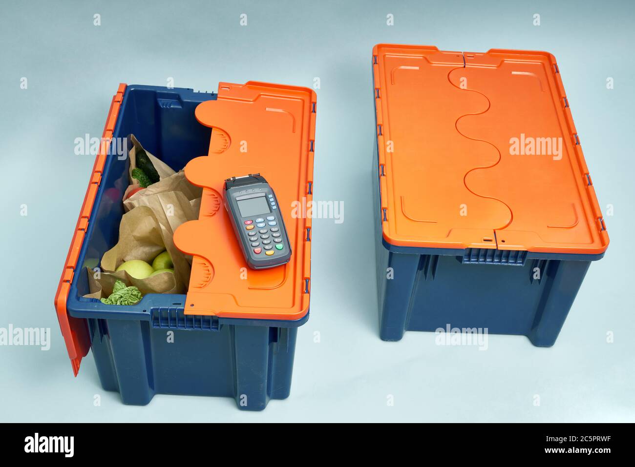 Plastic box with products. Food delivery in platinum boxes. Safe ...