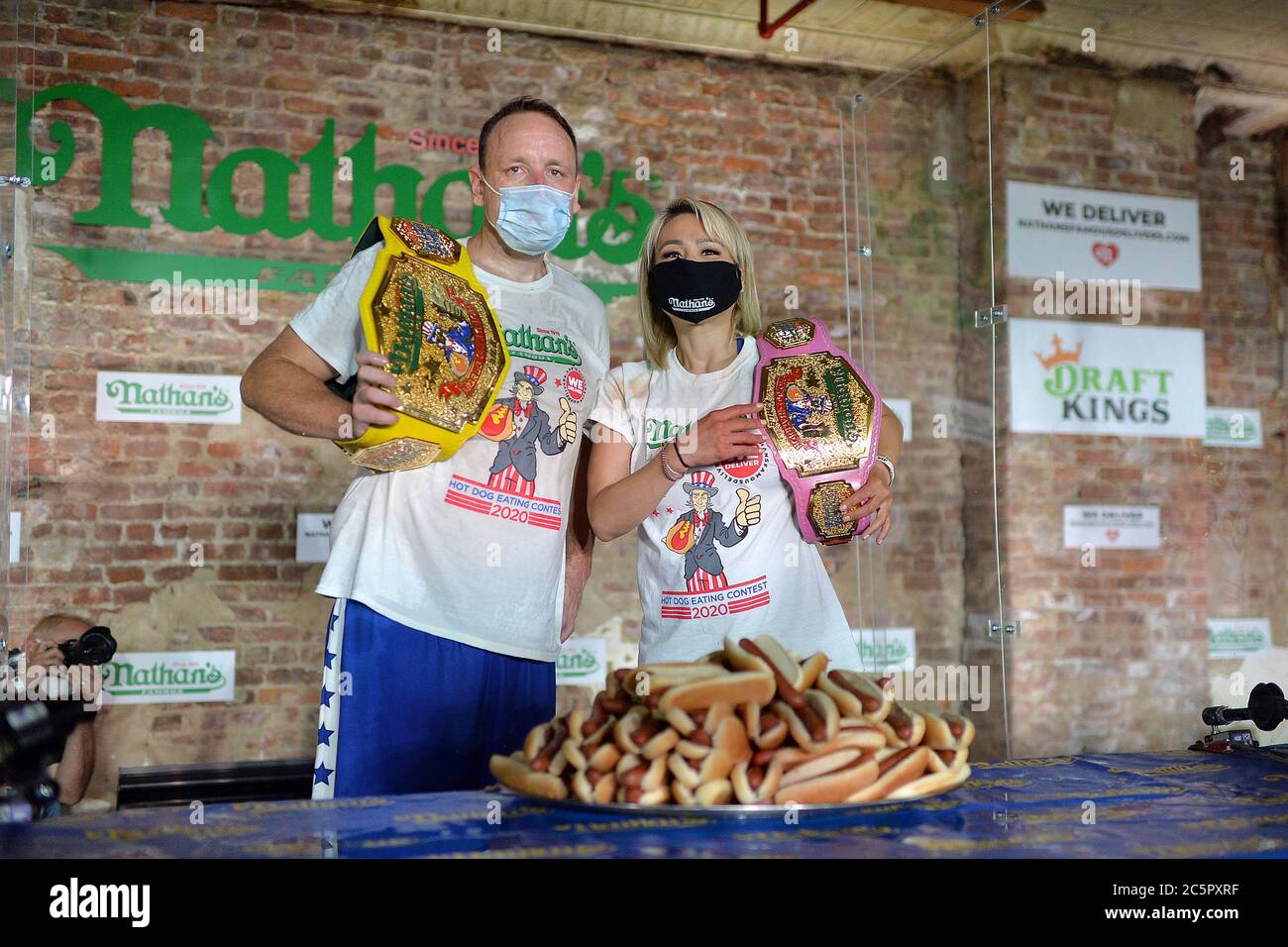 Competitive eaters Joey Chestnut (l), and Miki Sudo (r), pose for a ...