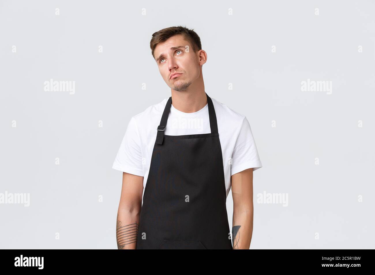 Employees, grocery stores and coffee shop concept. Reluctant and moody ...