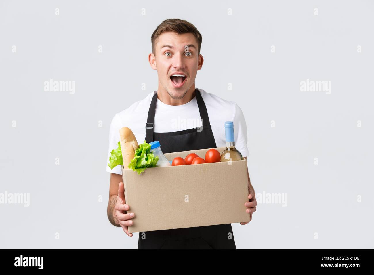 Retail, grocery shopping and delivery concept. Excited salesman ...