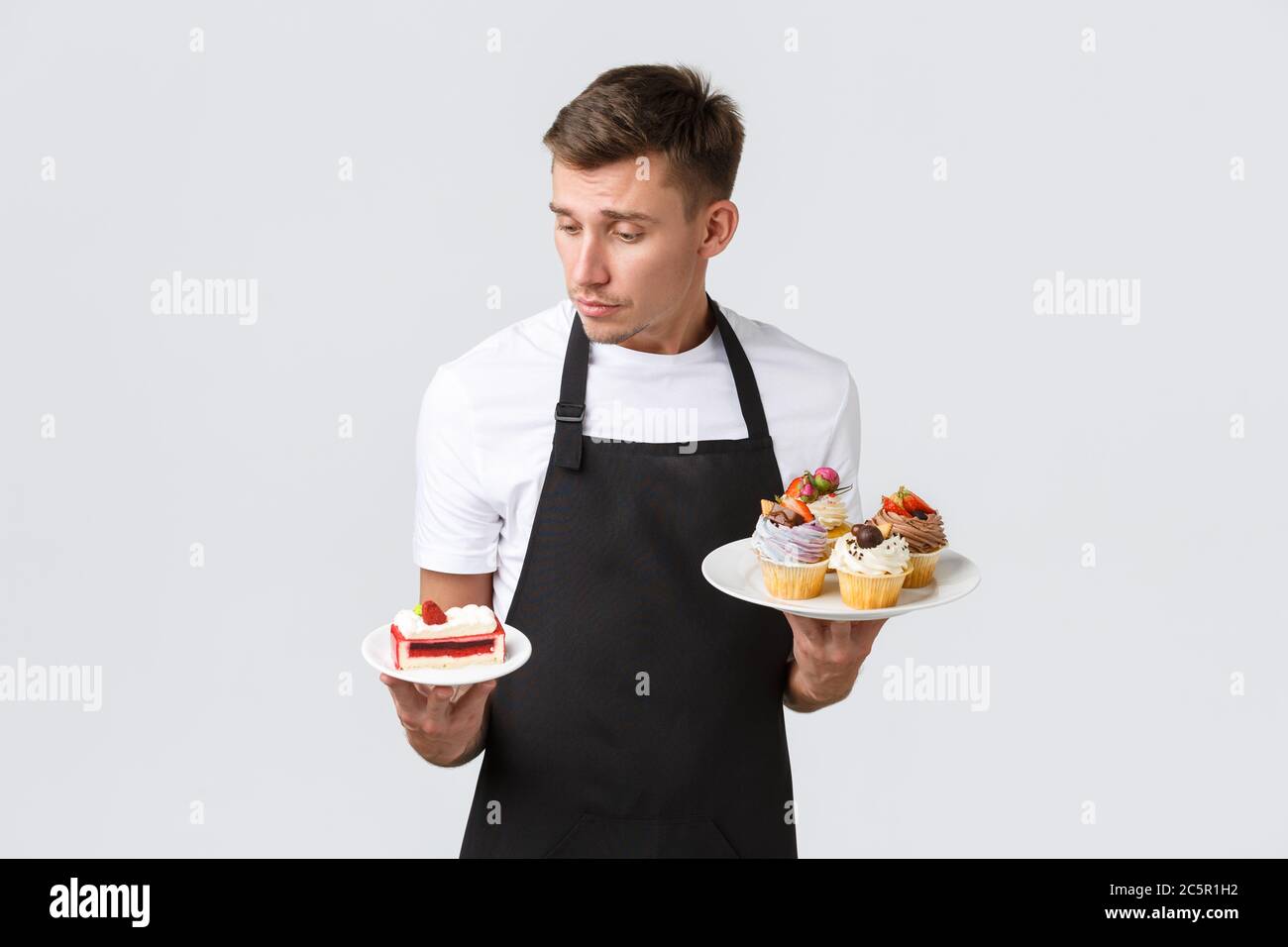 Small retail business, coffee shops and bakery concept. Handsome waiter ...