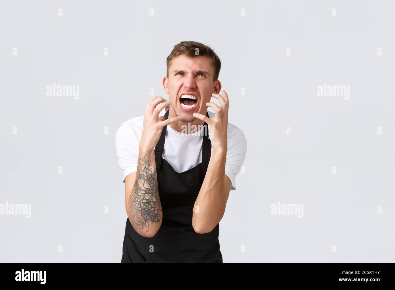 Employees, grocery stores and coffee shop concept. Hateful and angry ...