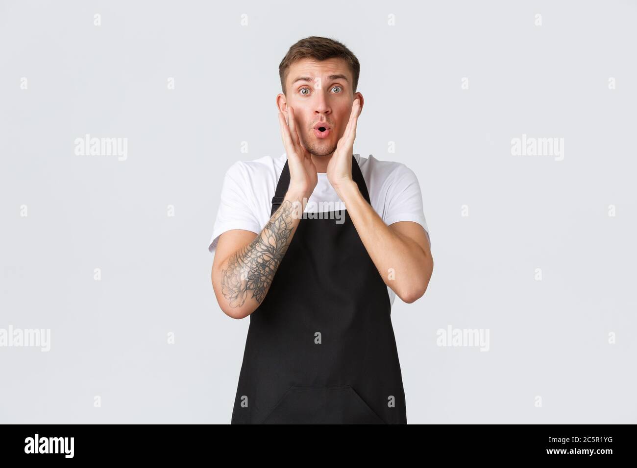 Small business owners, coffee shop and staff concept. Surprised blond ...