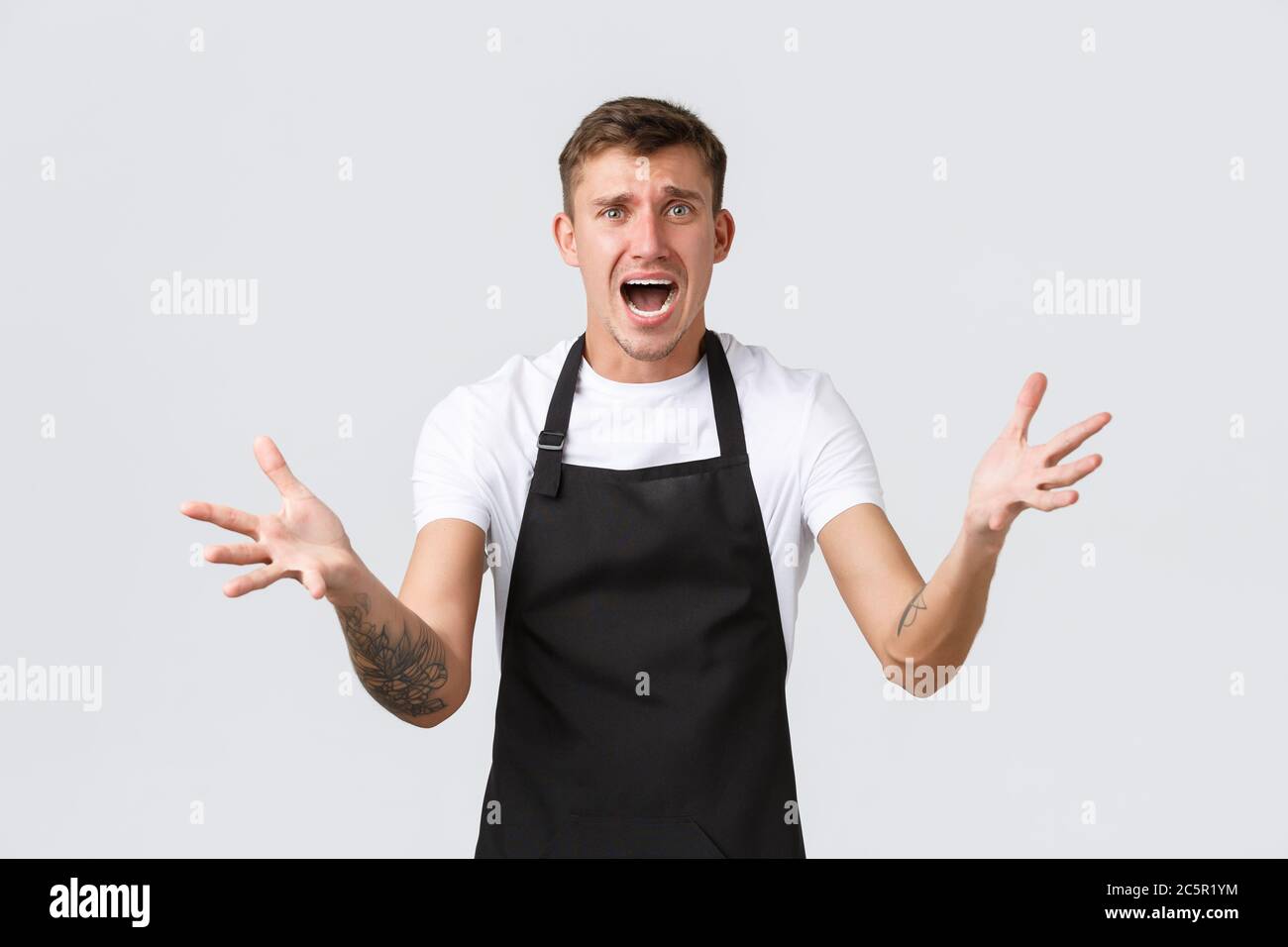 Employees, grocery stores and coffee shop concept. Shocked barista ...