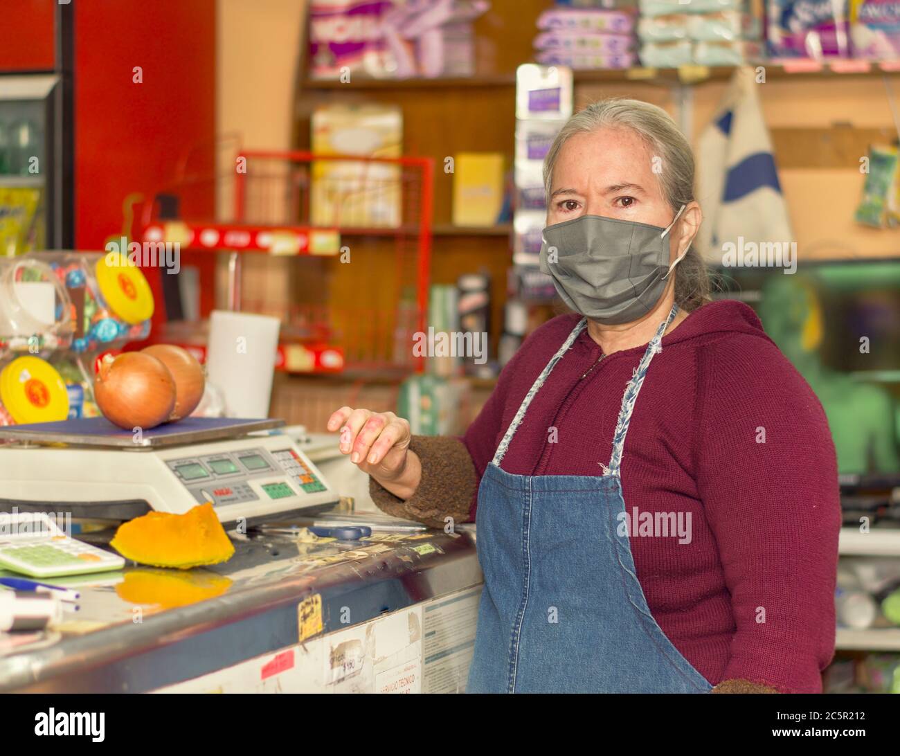 Food store owner wearing mask hi-res stock photography and images - Alamy