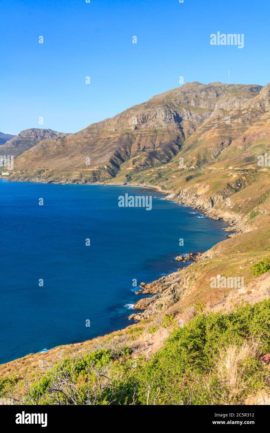 A vertical photograph of the rugged coastline along the Cape Peninsula ...