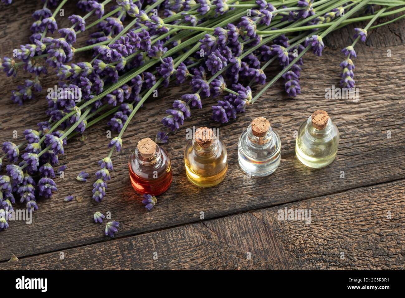 Bottles of essential oil with fresh lavender flowers Stock Photo - Alamy