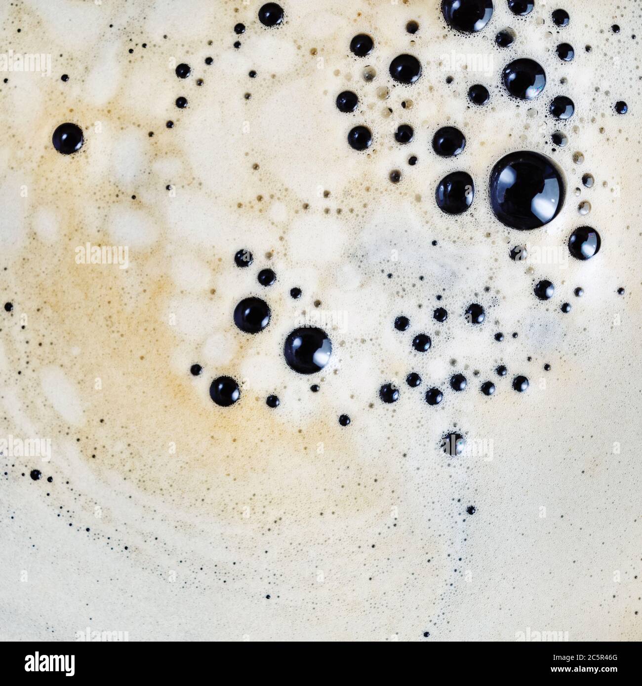 Close-up coffee background. Coffee foam with bubbles. Top view. Flat ...