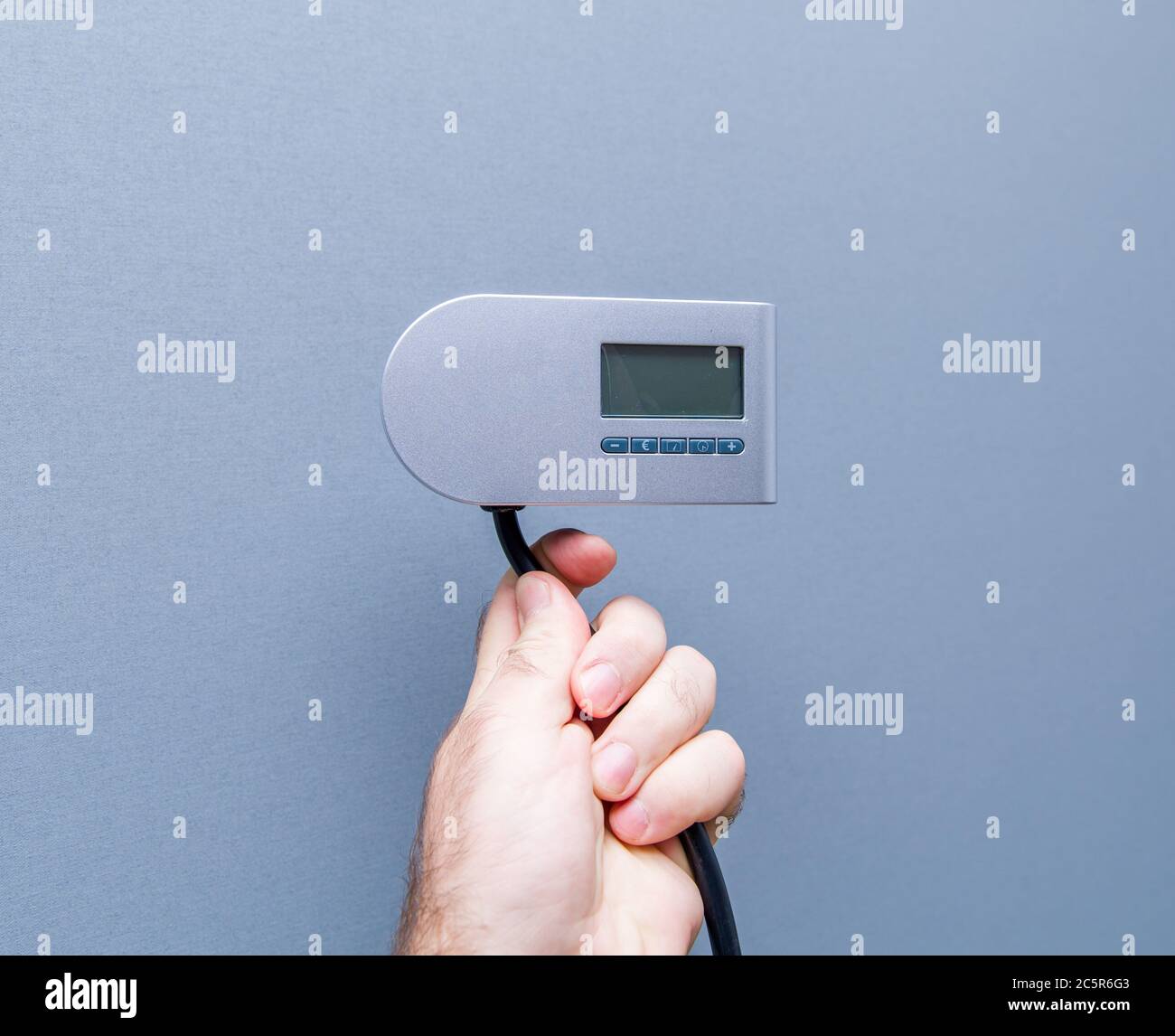 Man hand holding against blue technology background new electronic ...