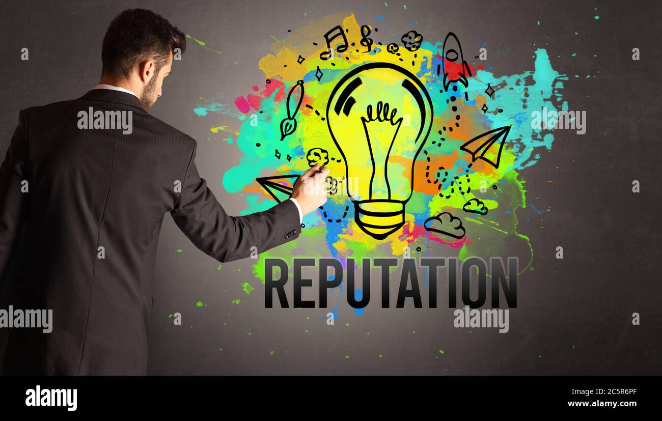 businessman drawing colorful light bulb with REPUTATION inscription on ...