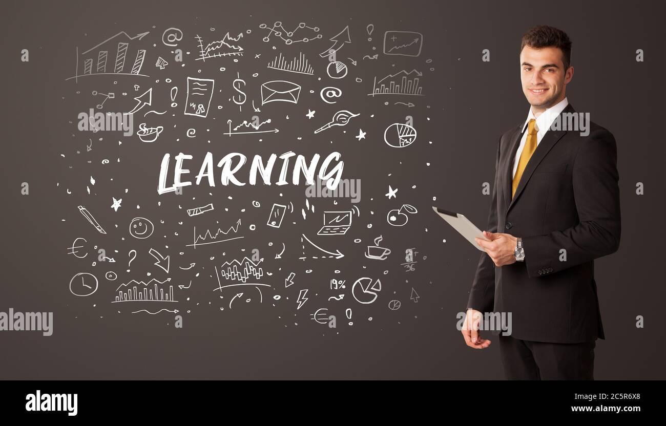 Businessman thinking with LEARNING inscription, business education ...