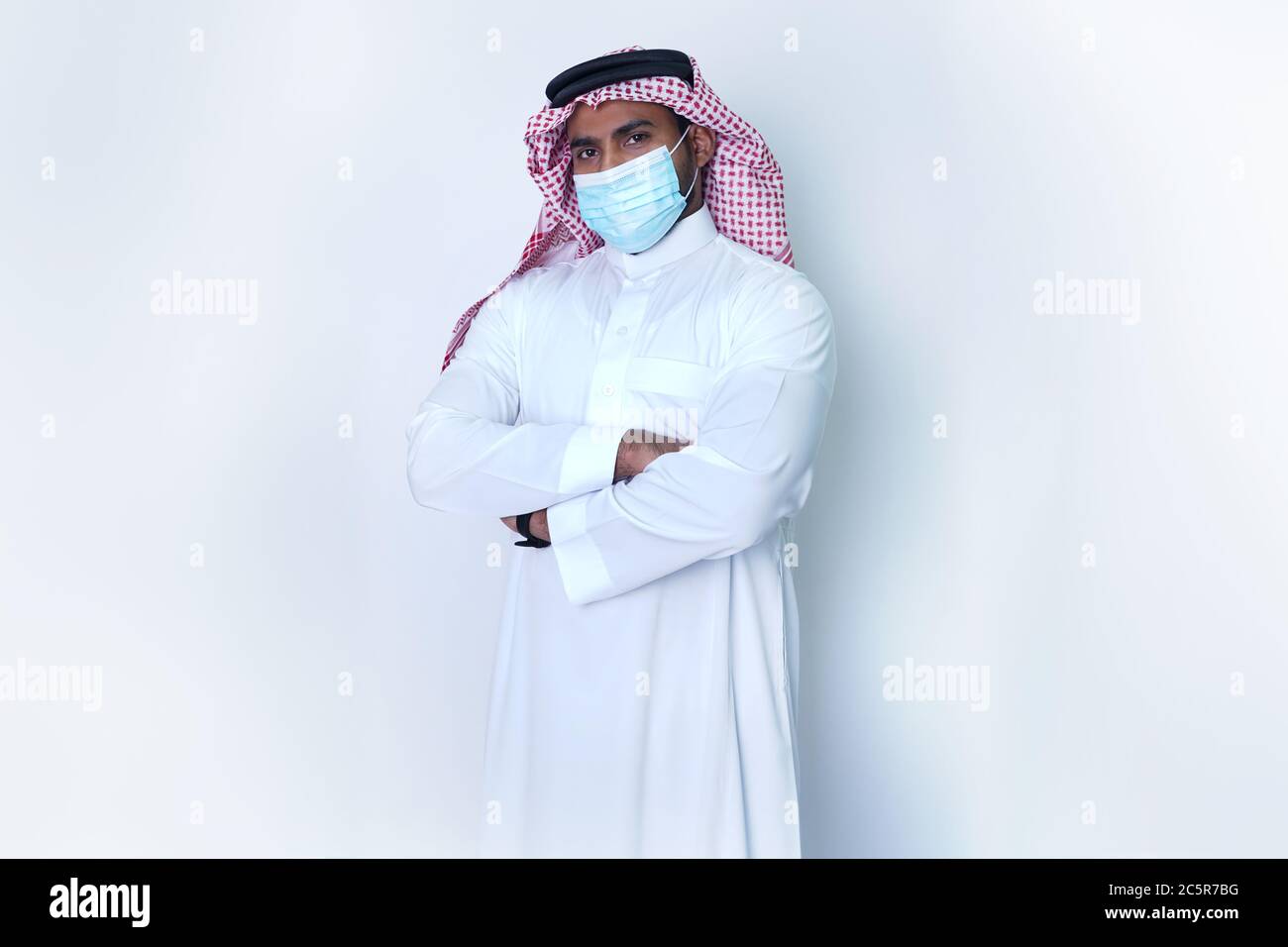 Saudi Arab Man standing in confidence by folding hands Stock Photo - Alamy