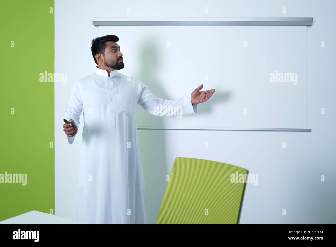 Saudi Arab Man explaining and presenting in conference room Stock Photo ...