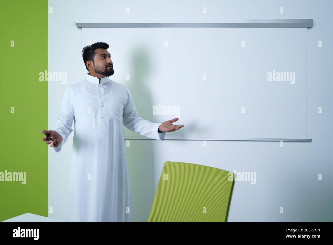 Saudi Arab Man explaining and presenting in conference room Stock Photo ...