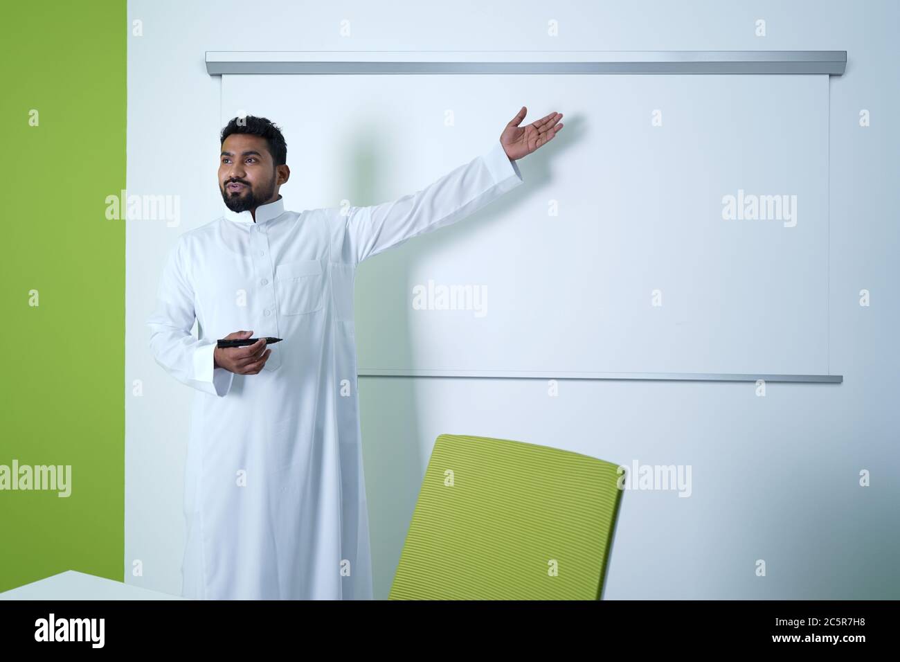 Saudi Arab Man explaining and presenting in conference room Stock Photo ...