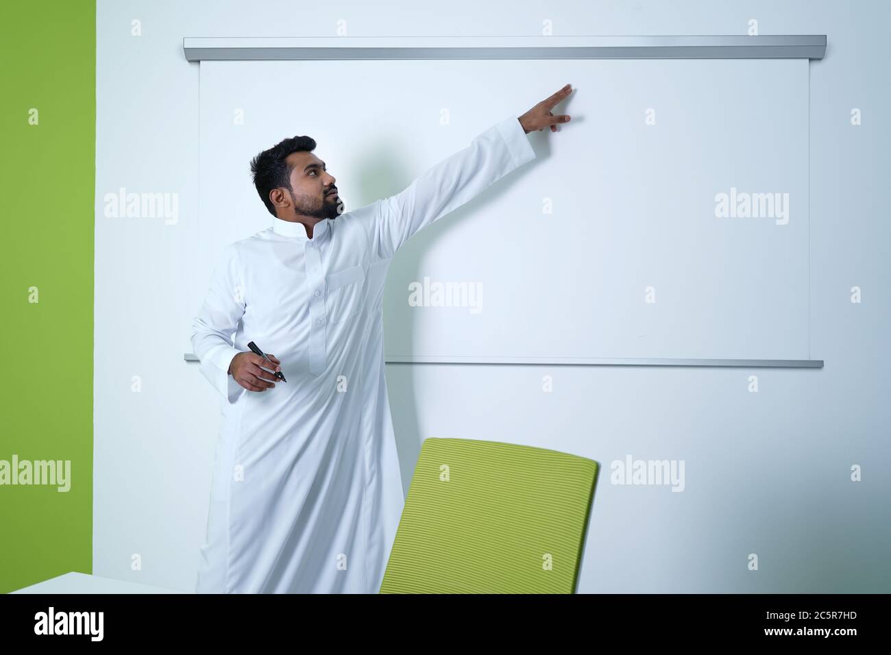 Saudi Arab Man explaining and presenting in conference room Stock Photo ...