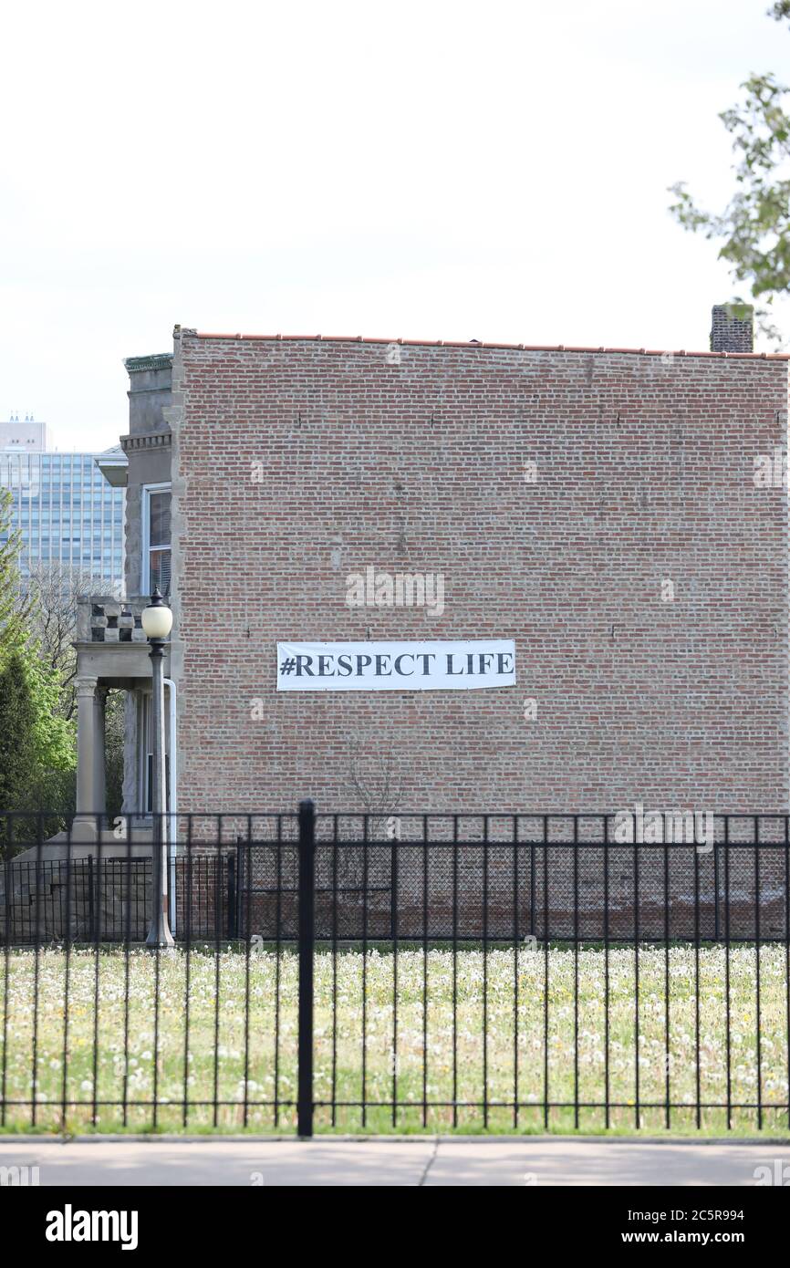 The words #RespectLife Hanging On A Banner On The Side Of A Residential ...