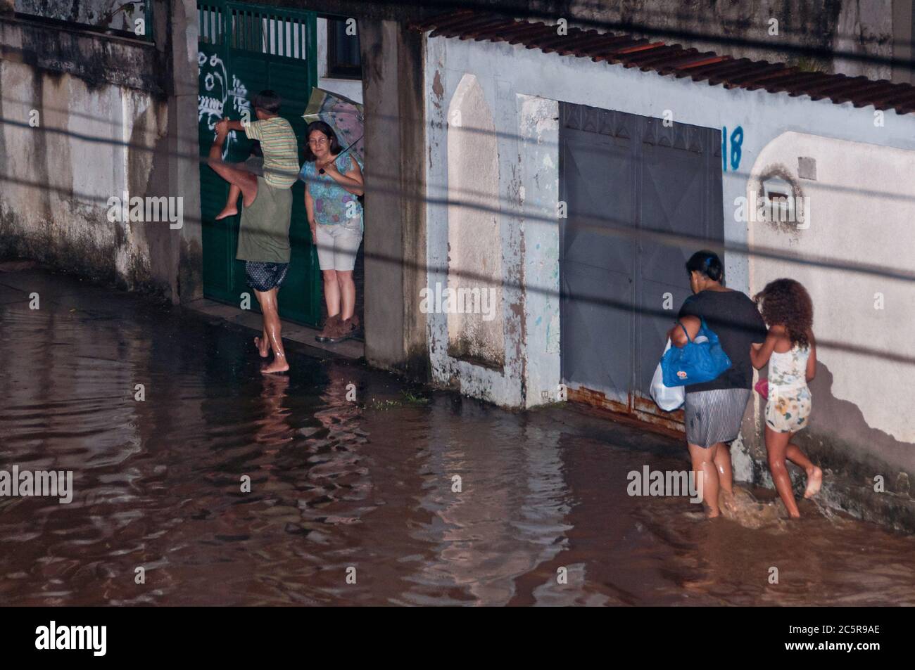 Poor living area in Rio de Janeiro flooded after heavy rain. Water ...