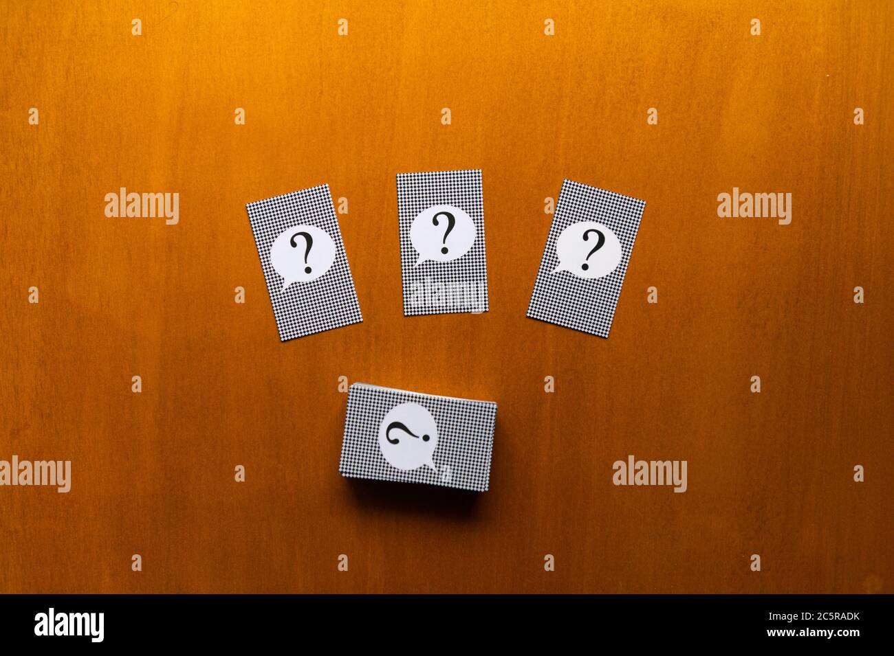 Question mark heap on table concept for confusion, question or solution ...