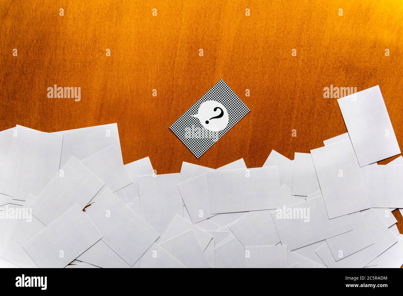 Question mark heap on table concept for confusion, question or solution ...