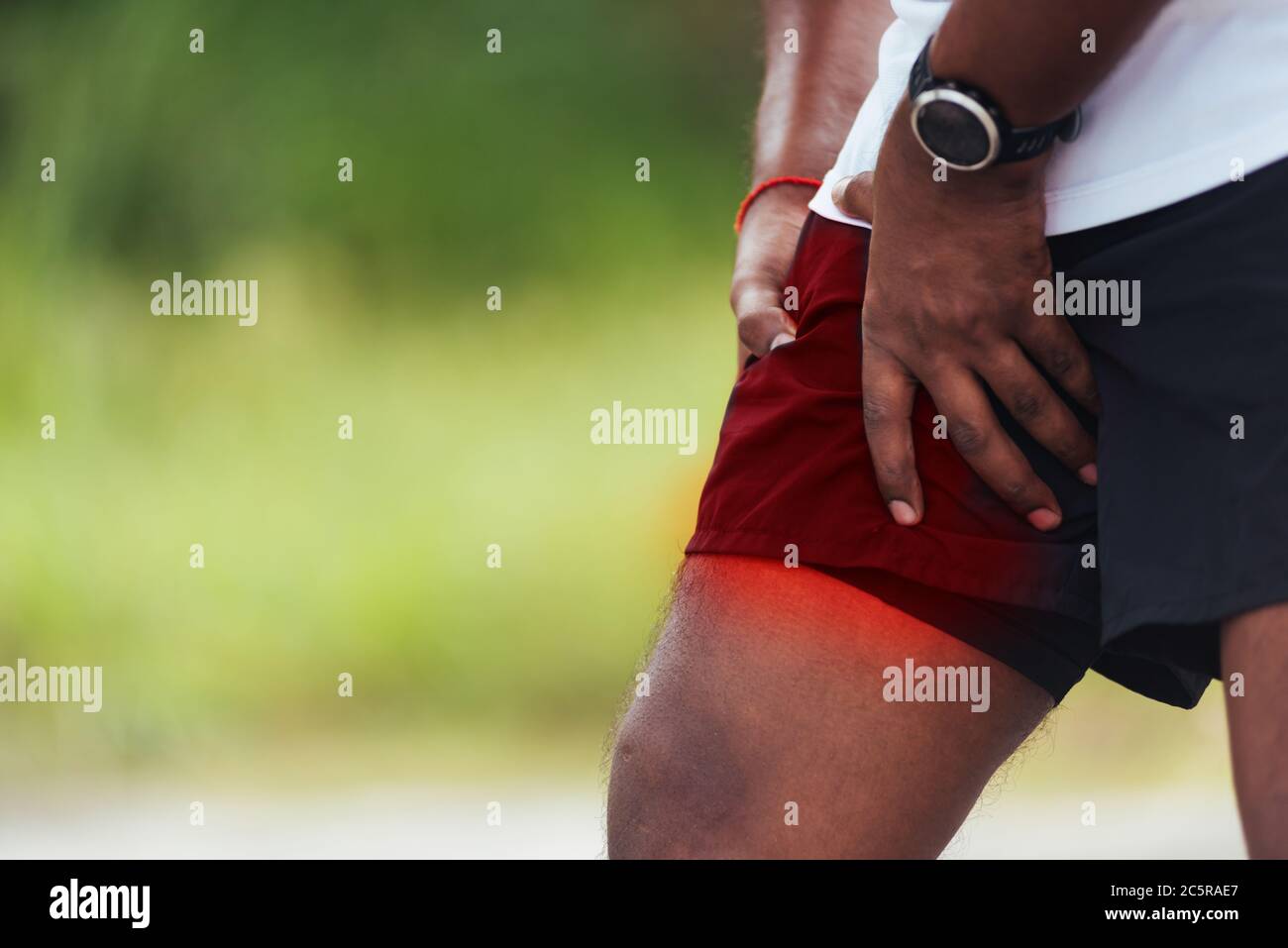 Close up Asian young sport runner black man wear watch hands joint hold ...