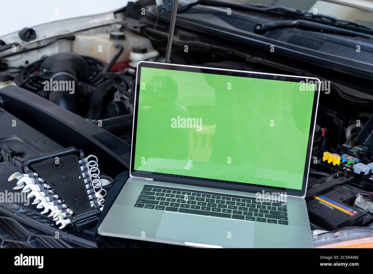 Laptop on hood of car hi-res stock photography and images - Alamy