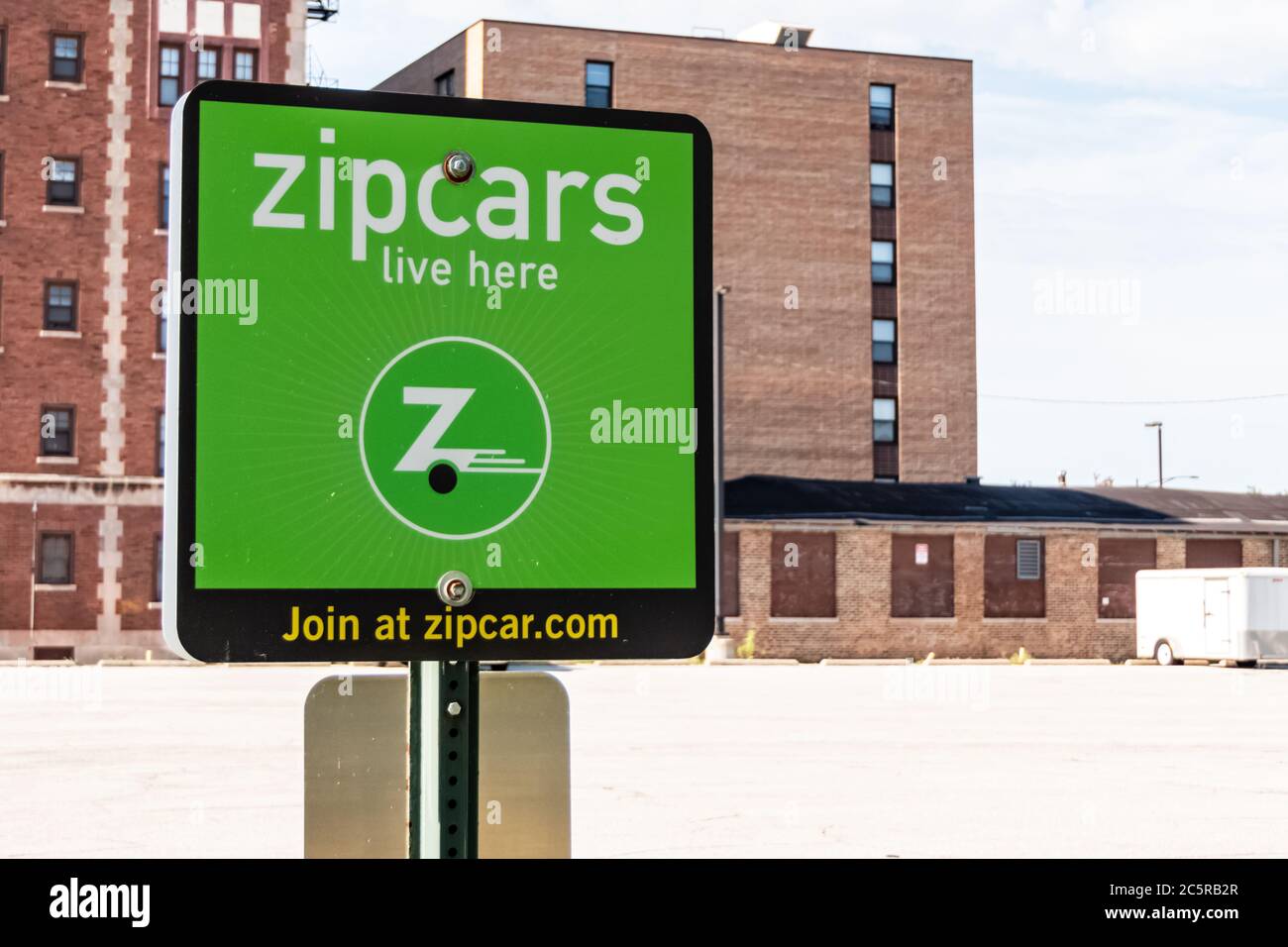 Zipcar rideshare sign buy a parking lot Stock Photo - Alamy