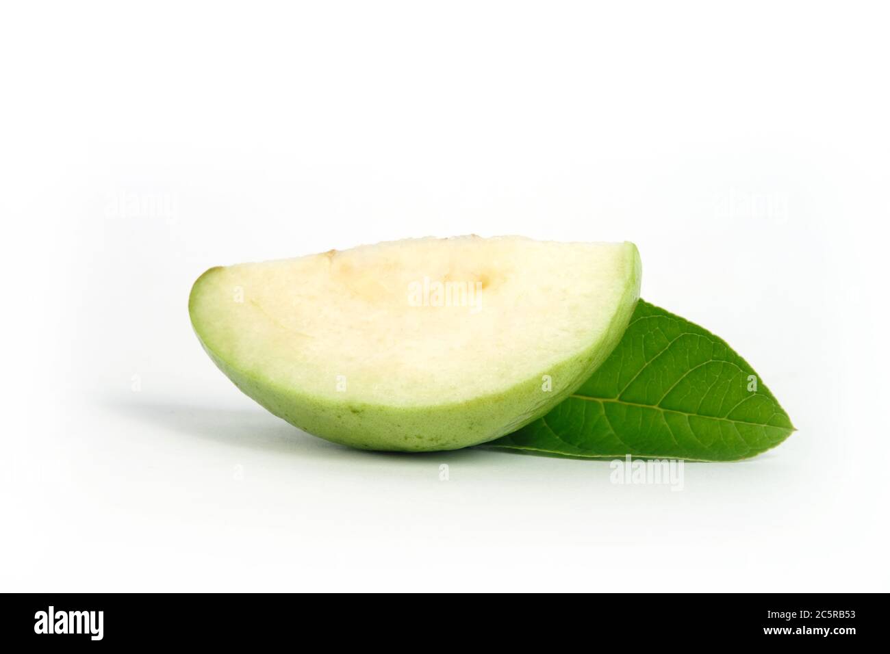 Green crystal guava raw fruit and sliced with leaves isolated on a ...