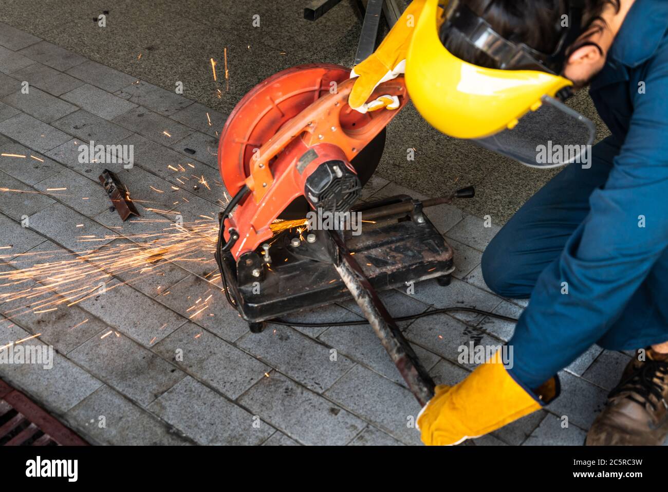 Professional mechanic is cutting steel metal Stock Photo - Alamy