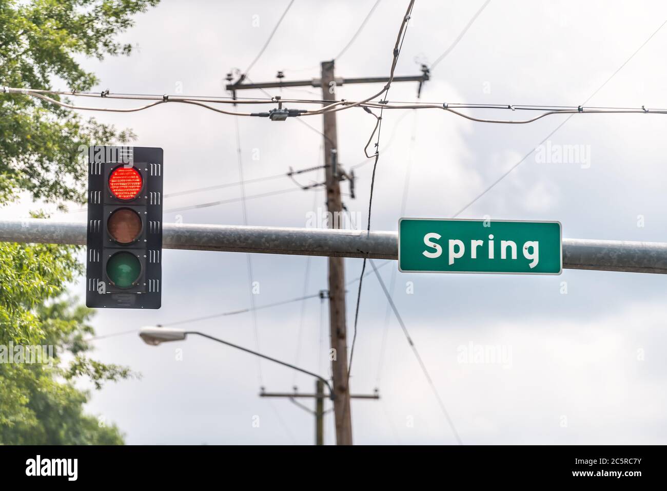 Hot Springs, Arkansas Spring road sign green text on street in downtown ...