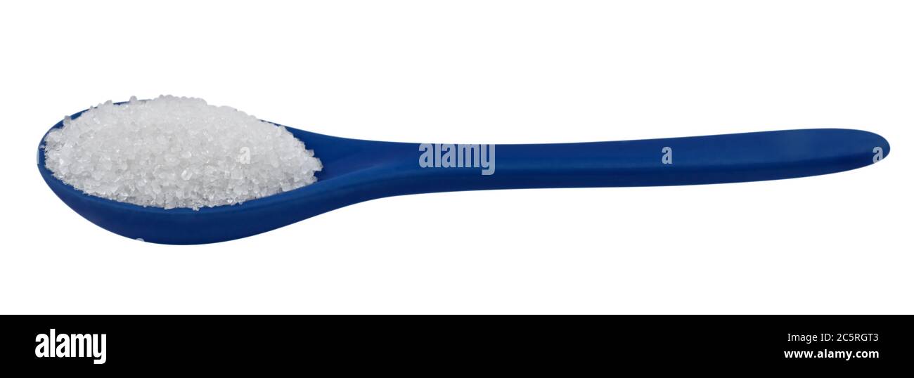 Single blue porcelain spoon with sugar isolated on white. Clipping path ...