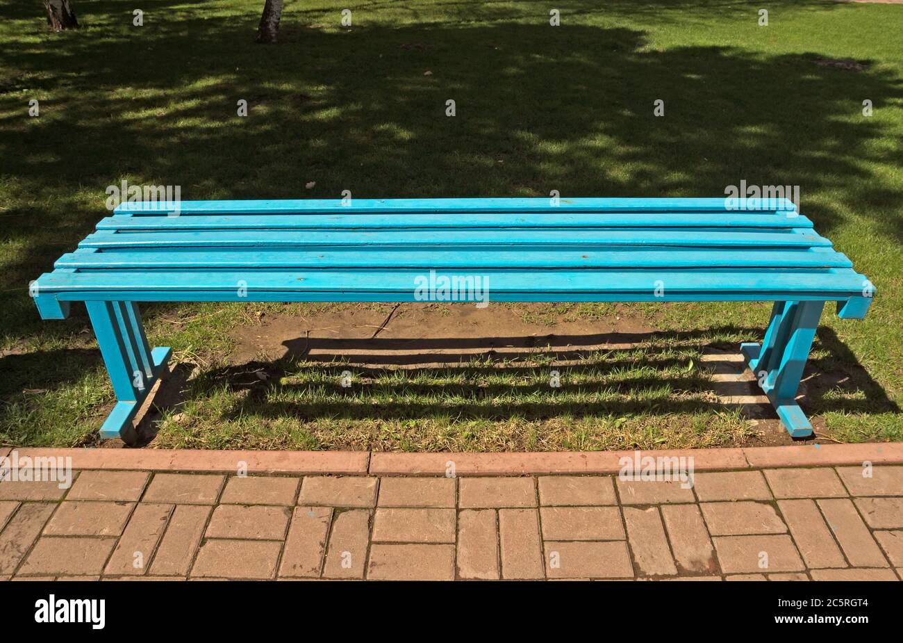 Wooden blue bench in the city park Stock Photo - Alamy