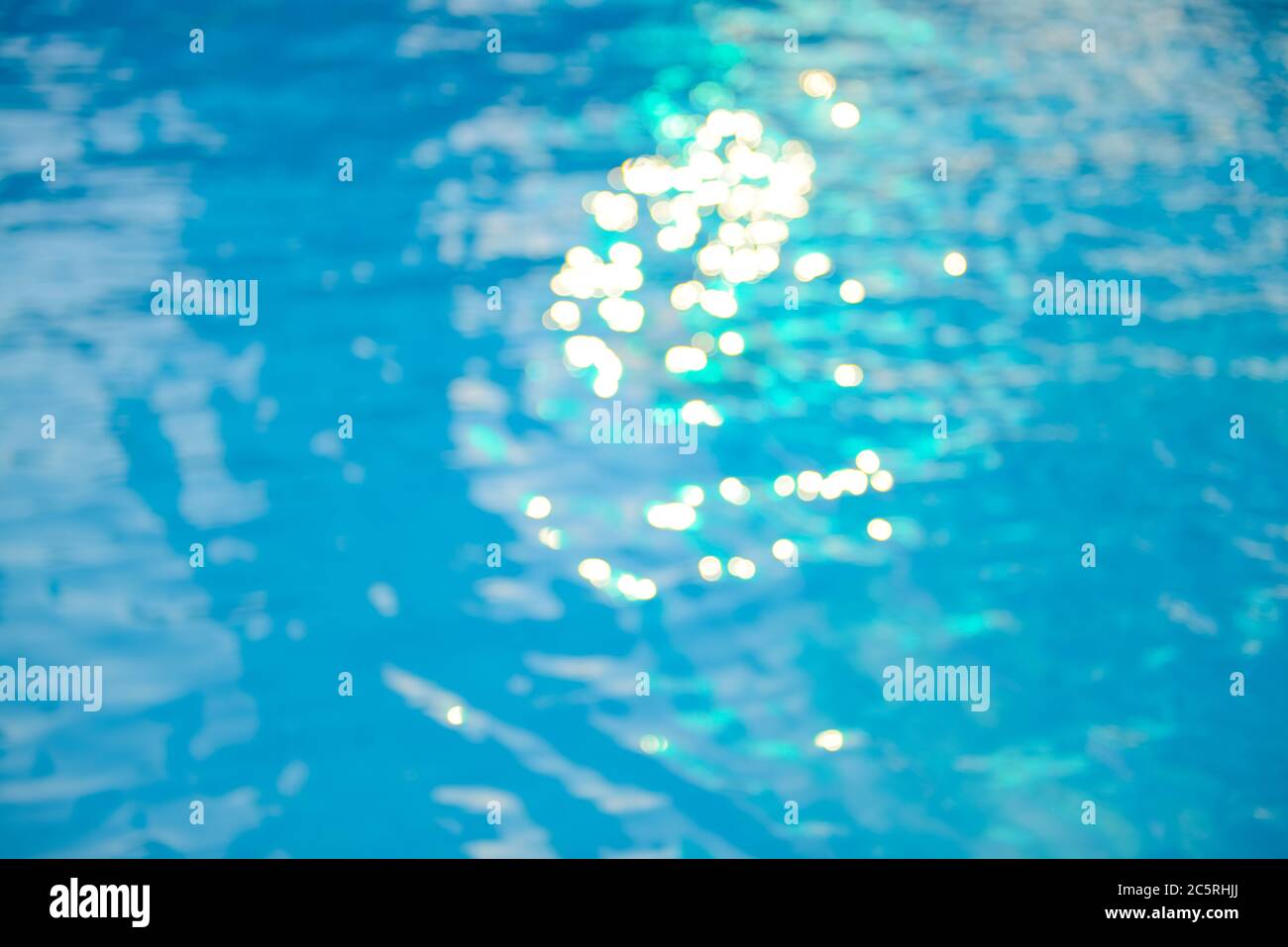 Soft focus bokeh light effects over a rippled, blue water background in the pool Stock Photo - Alamy
