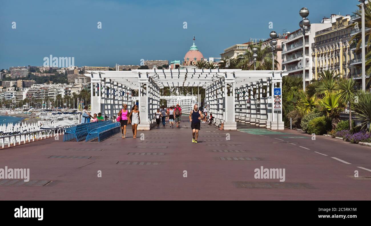 NICE, FRANCE - JUNE 6, 2014: Pedestrians walking on Promenade des ...