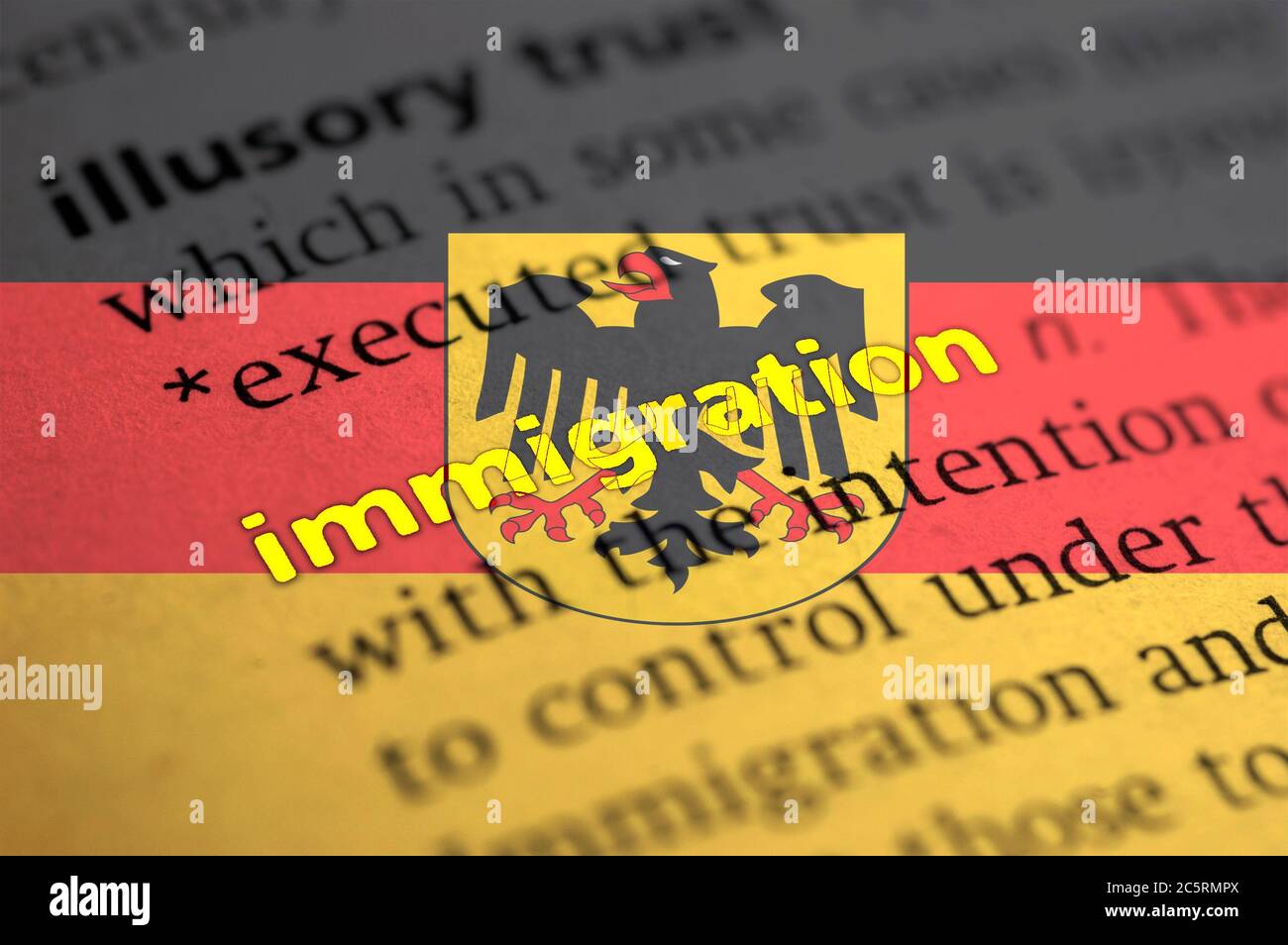 Dictionary definition of immigration on a German flag Stock Photo - Alamy