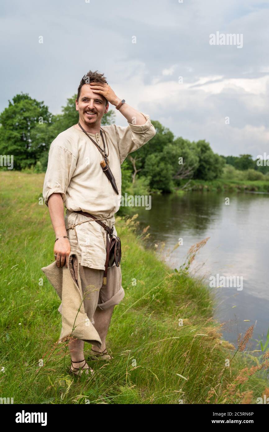 Expedition of live history lovers. A man in working clothes of a Viking ...