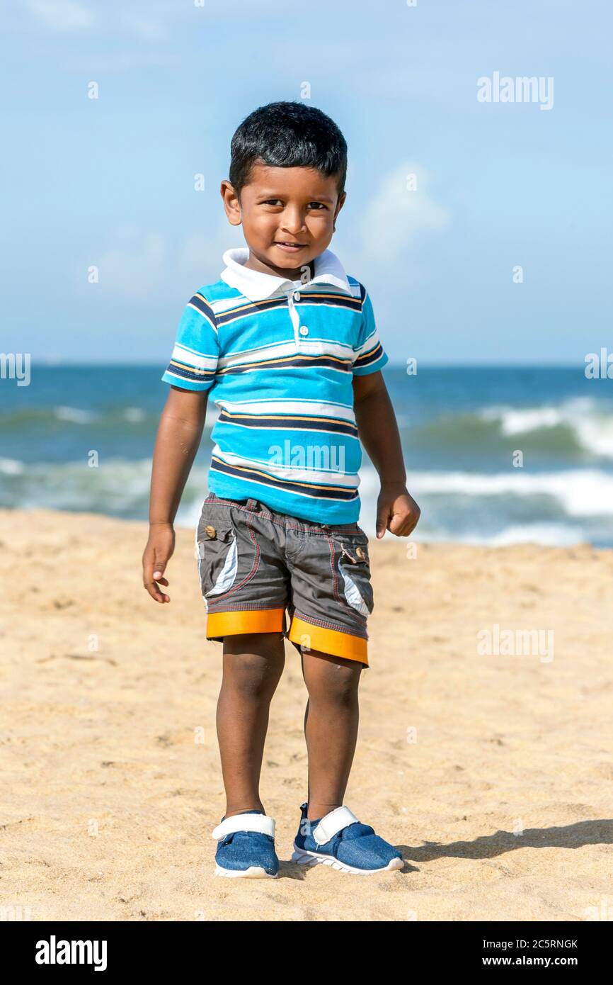 A Sri Lankan boy playing on Negombo beach in Sri Lanka in the early ...