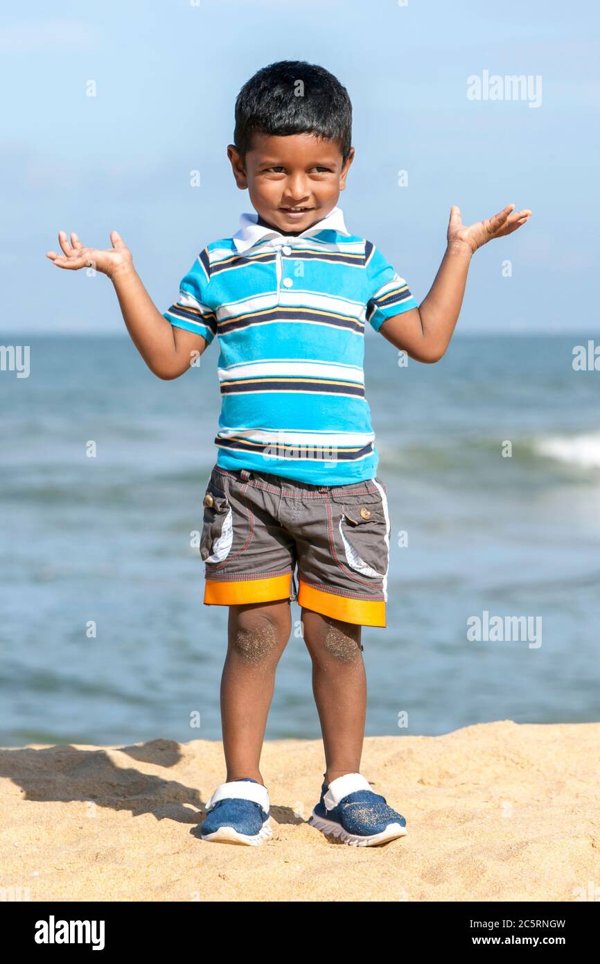 A Sri Lankan boy playing on Negombo beach in Sri Lanka in the early ...