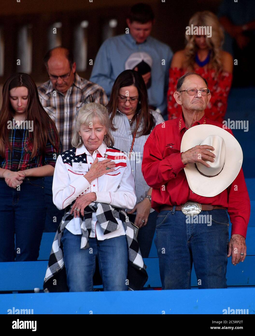 Prescott, AZ, USA. 3rd July, 2020. Rodeo fans stand for the national ...