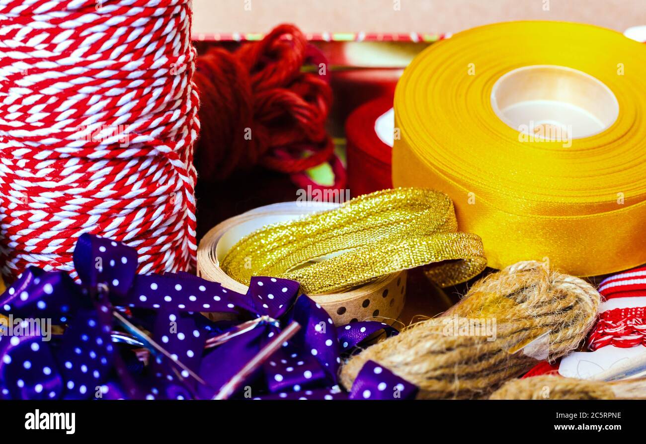 Rope roll, ribbon and gift bow in the box Stock Photo - Alamy
