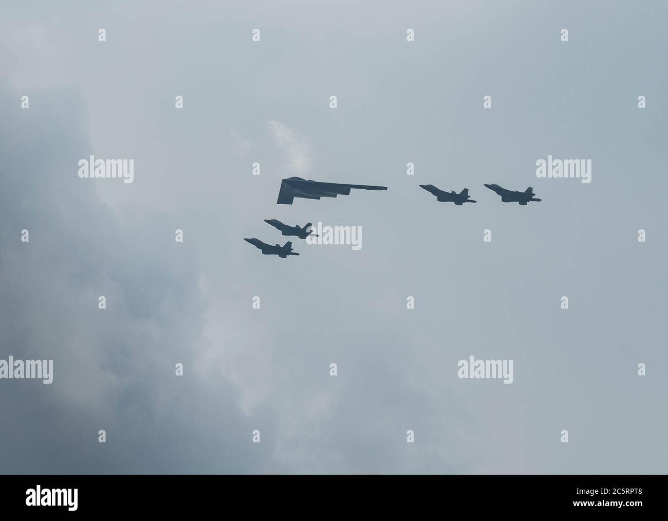 New York, NY - July 4, 2020: B-2 Stealth Bomber with escort of F-35 ...