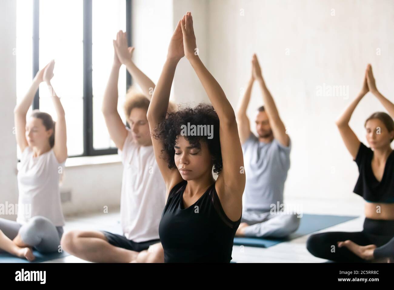 Young peaceful african american woman learner meditating with closed ...