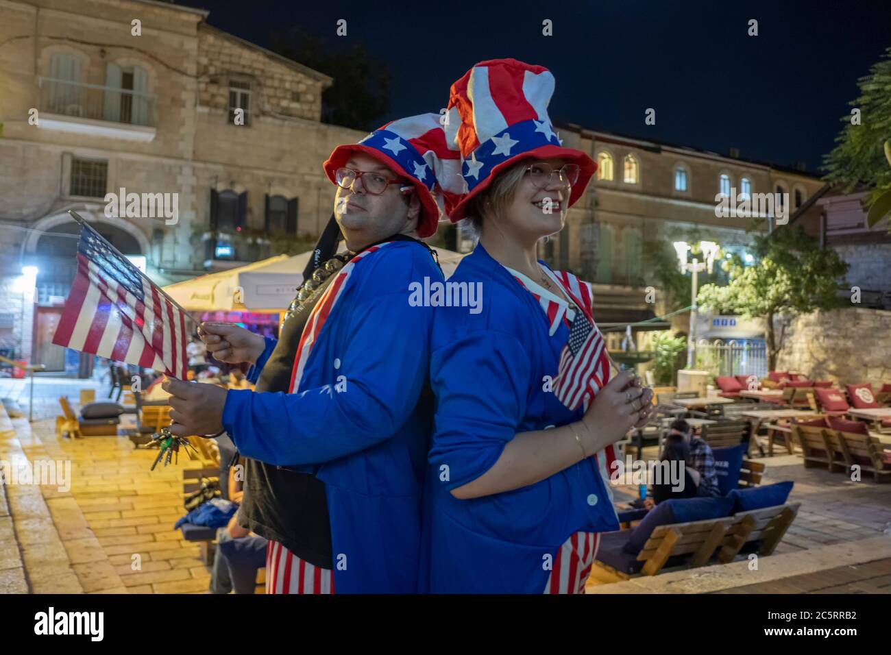 An Israeli couple dressed in a particularly patriotic Uncle Sam outfit ...